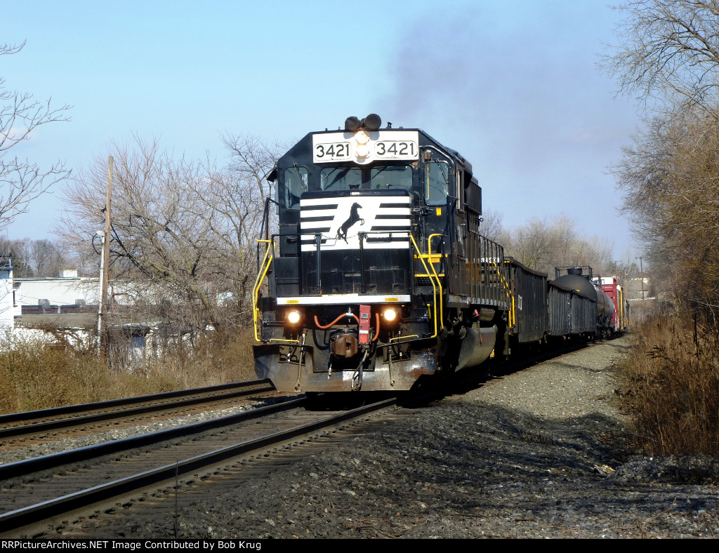 NS 3421 leads a local freight westbound